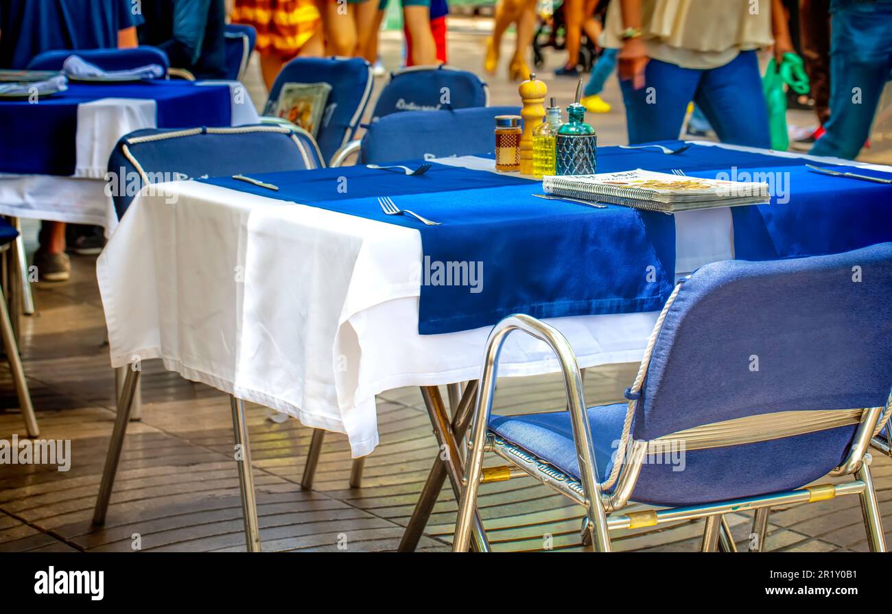 Tables with cutlery in a cafe on barcelona street. Photos from the trip ...