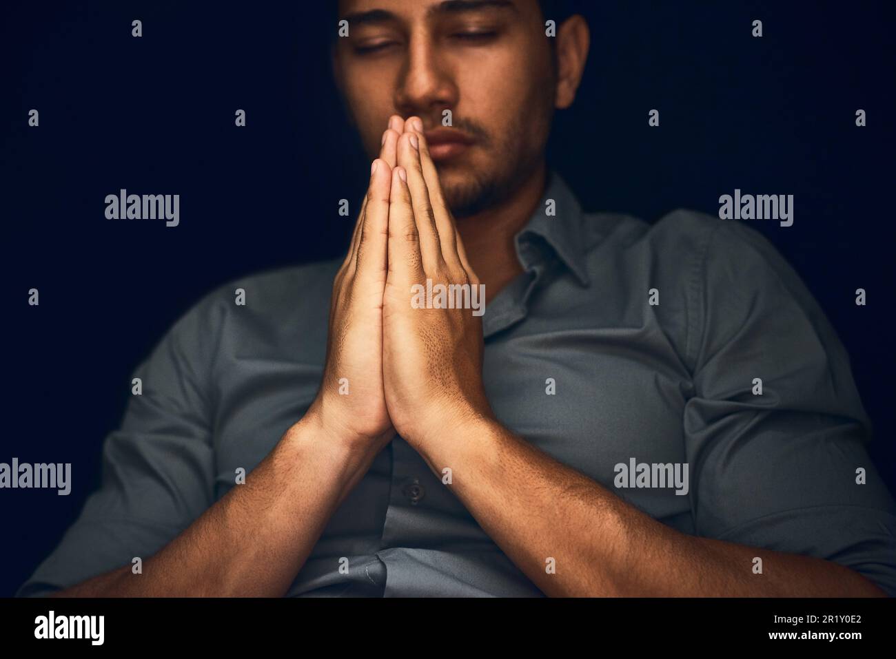Pray, worship and man with praying hands in studio for hope, faith and ...