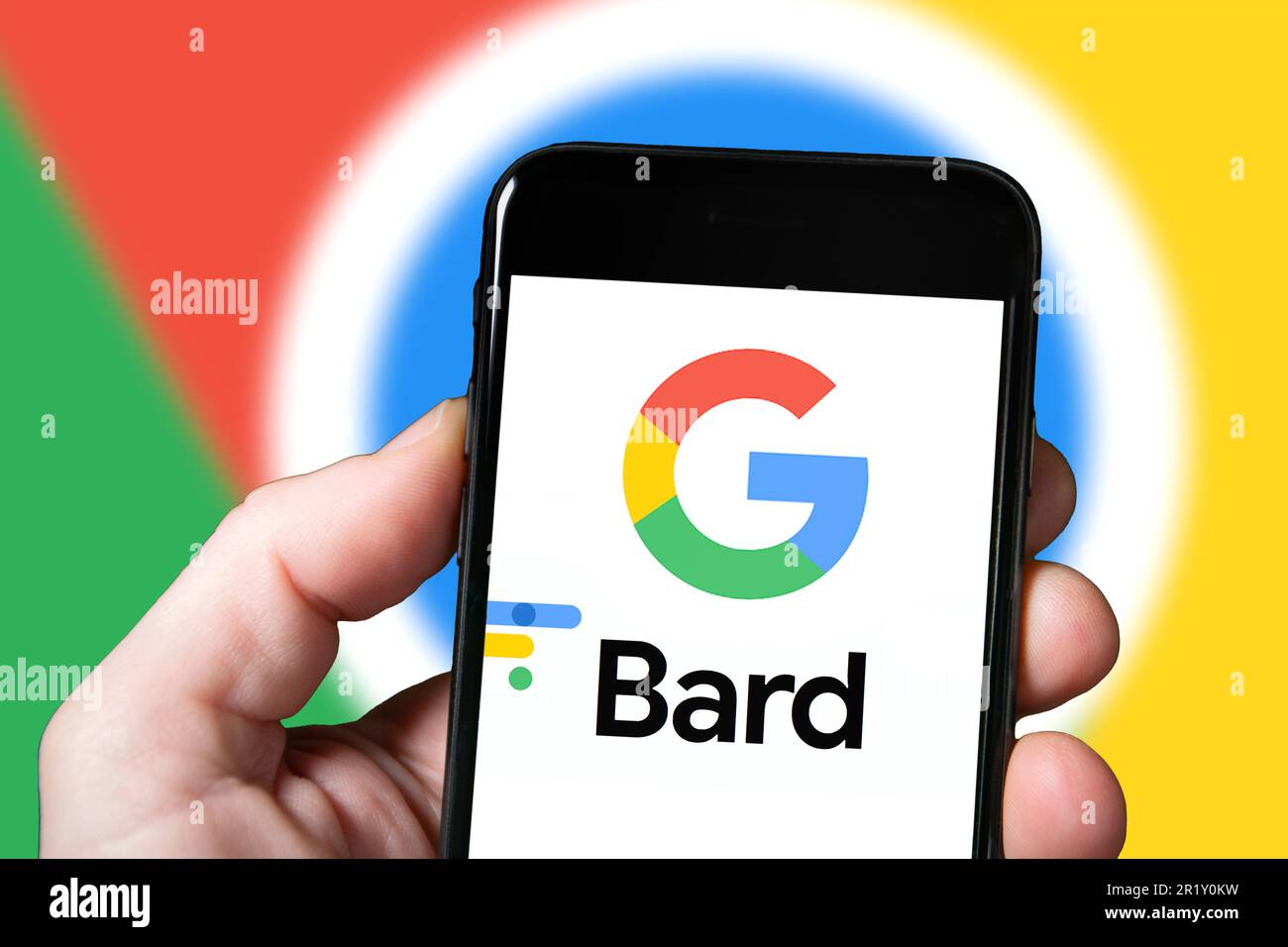 Goggle Bard AI chatbot artificial intelligence. Man with smartphone ...