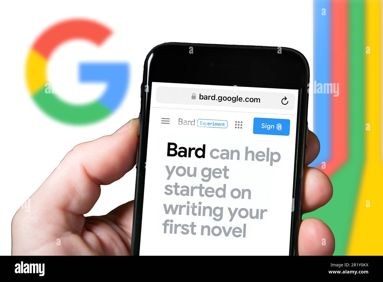 Goggle Bard AI chatbot artificial intelligence. Man with smartphone ...