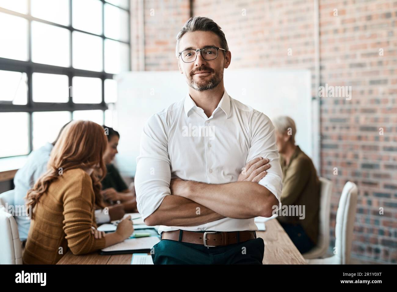 Portrait, leader and man with arms crossed, startup success and manager with teamwork. Face ...