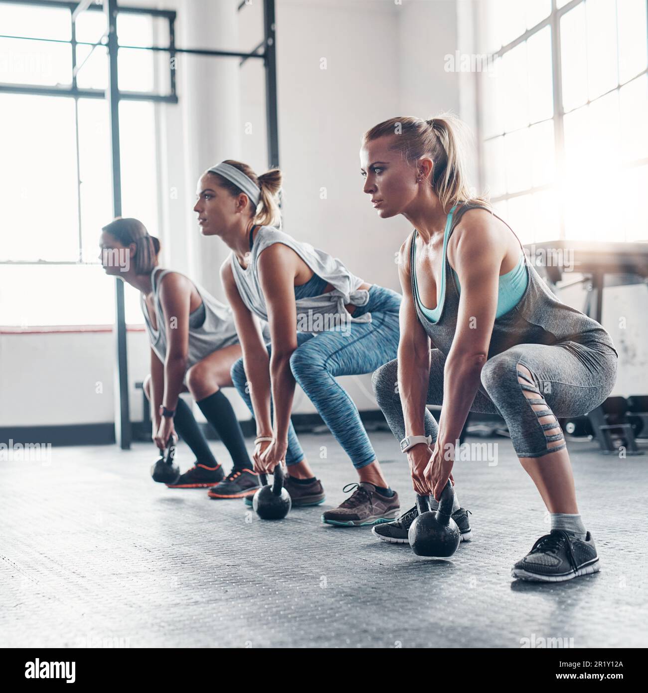 Group, exercise and women training, kettlebell and workout goal with ...