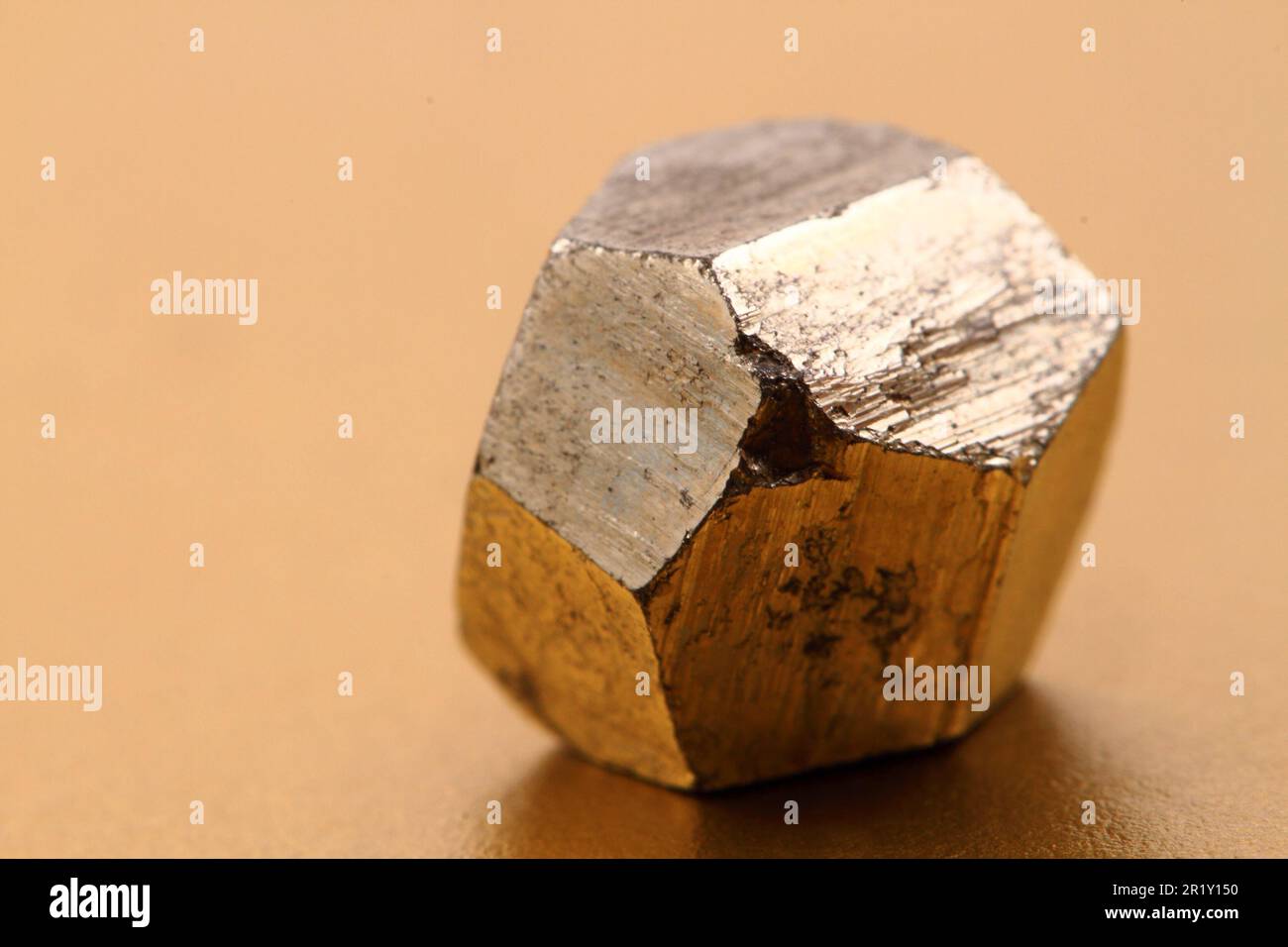 pyrite cubes isolated on the golden background Stock Photo - Alamy