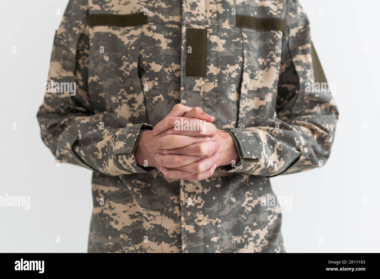 Closeup Shot Of Clasped Hands Of Unrecognizable Soldier In Camouflage ...