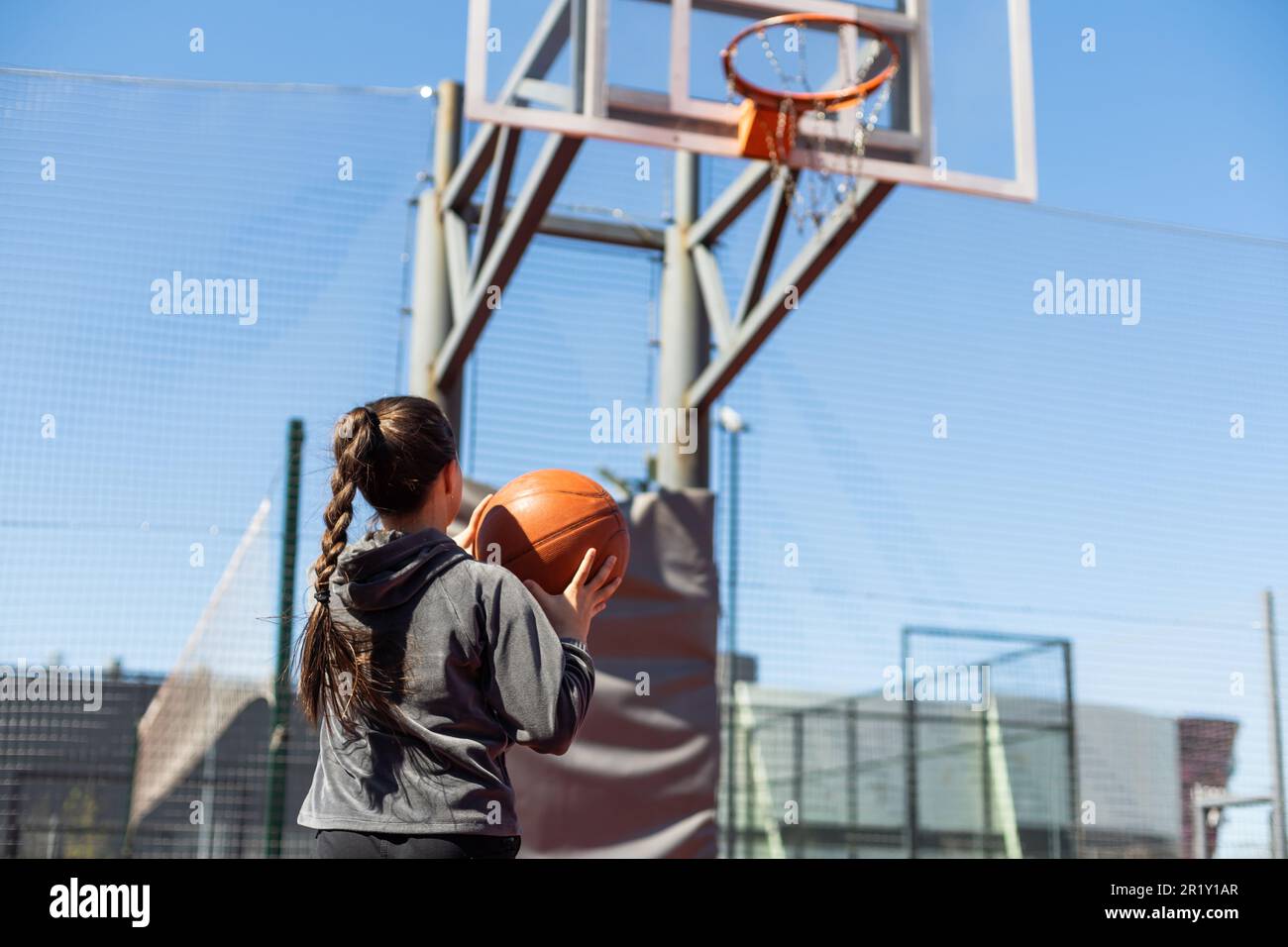 beautiful girl shooting basket and playing basketball Stock Photo - Alamy