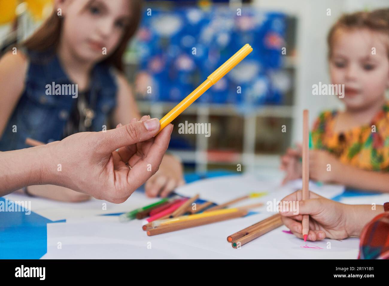 Close up photo of kids during an art class in a daycare center or ...