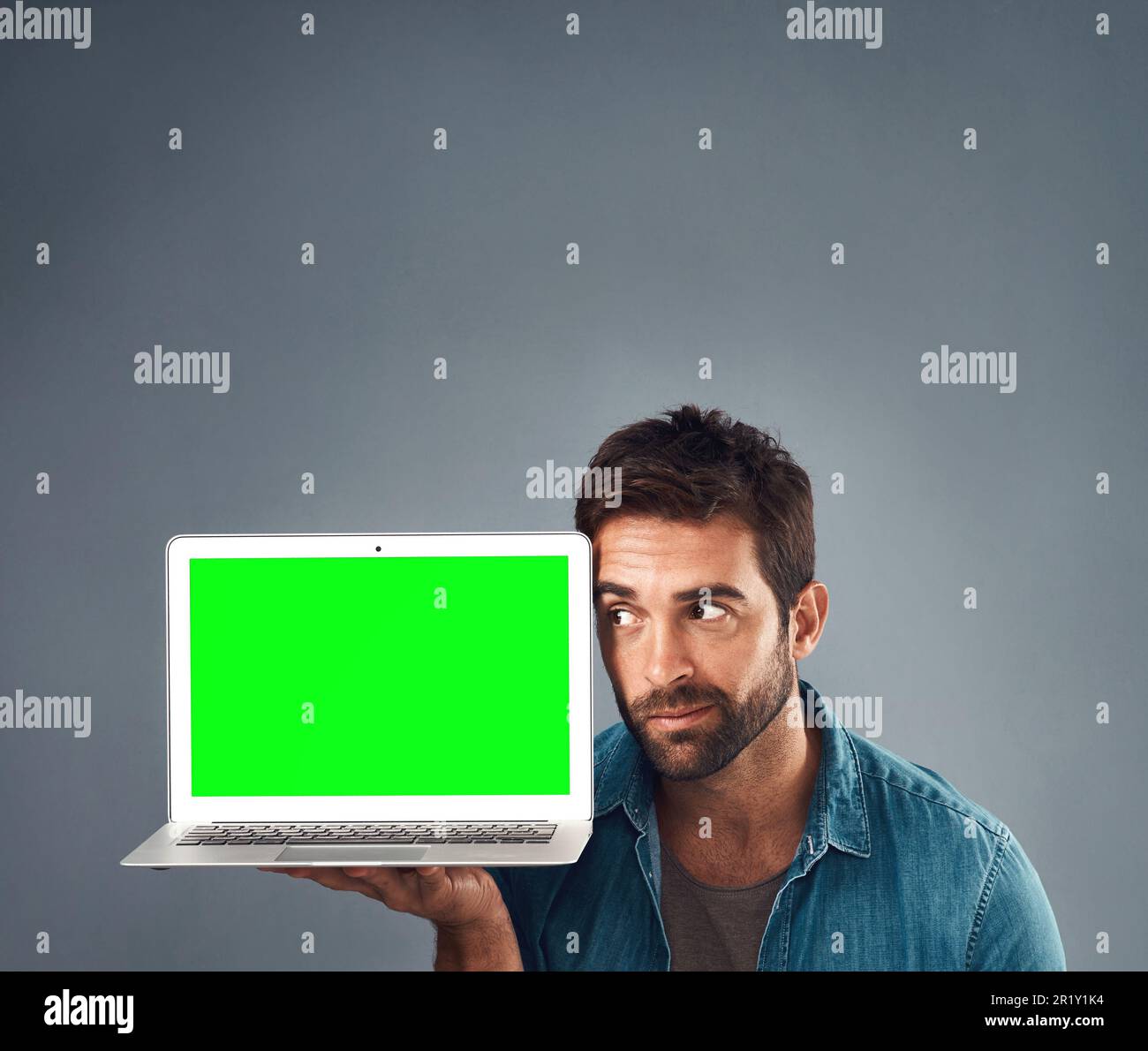 Man, laptop and thinking on mockup green screen for advertising or ...