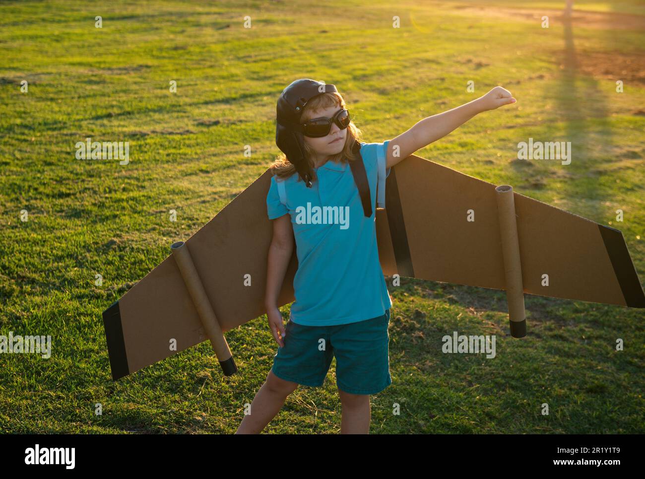 Kid traveller with backpack wings. Child playing pilot aviator and ...