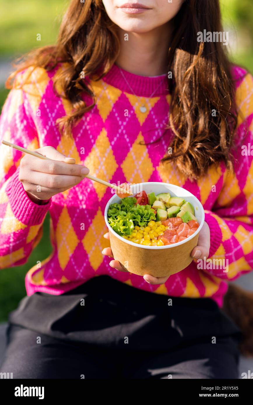 Woman eating healthy salad cropped view hi-res stock photography and ...