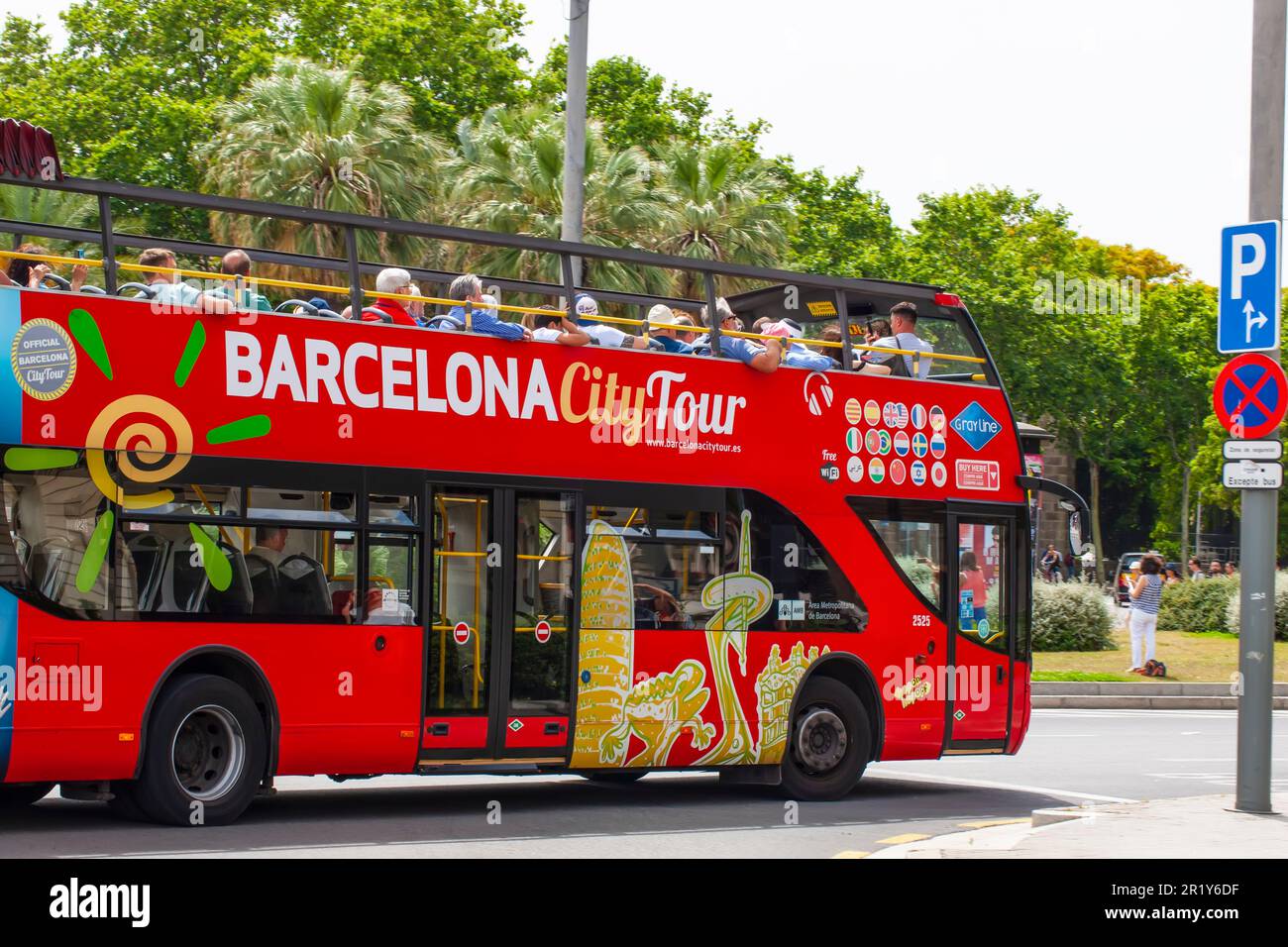 The Red Tourist bus and locals in summer 2018 in the street of ...