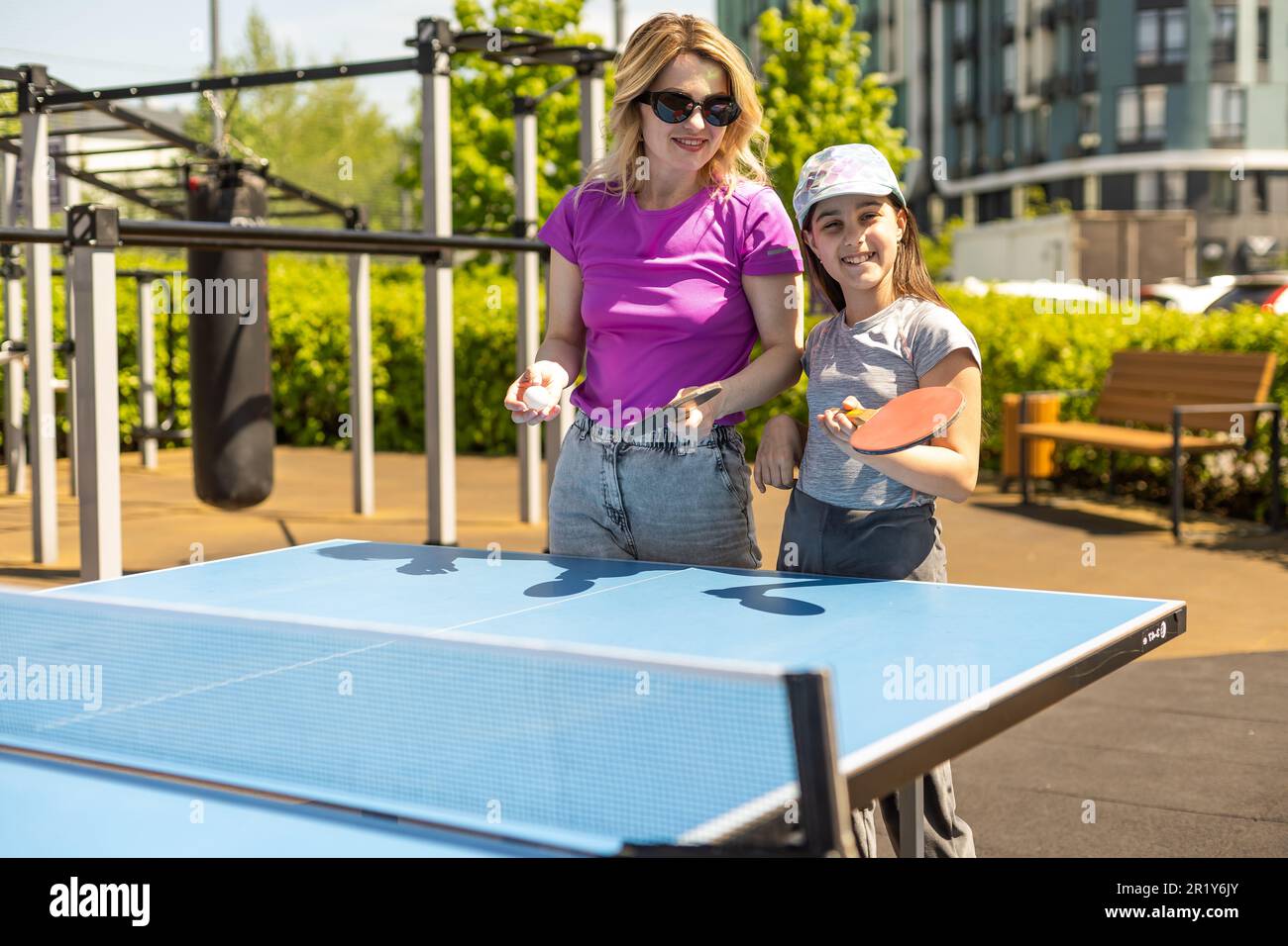 Happy Mother and Daughter Learning to Play Ping Pong Sport Cheerful ...