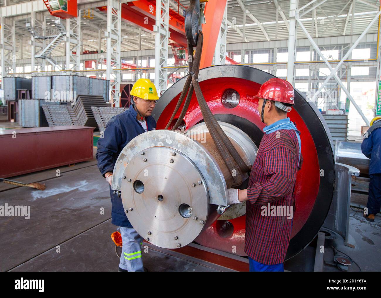 HAI'AN, CHINA - MAY 16, 2023 - Workers make large building materials ...