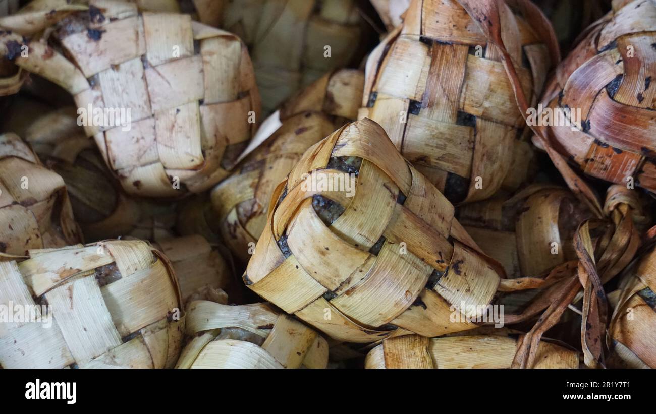 Ketupat is a typical Indonesian dish made of rice, wrapped in coconut ...