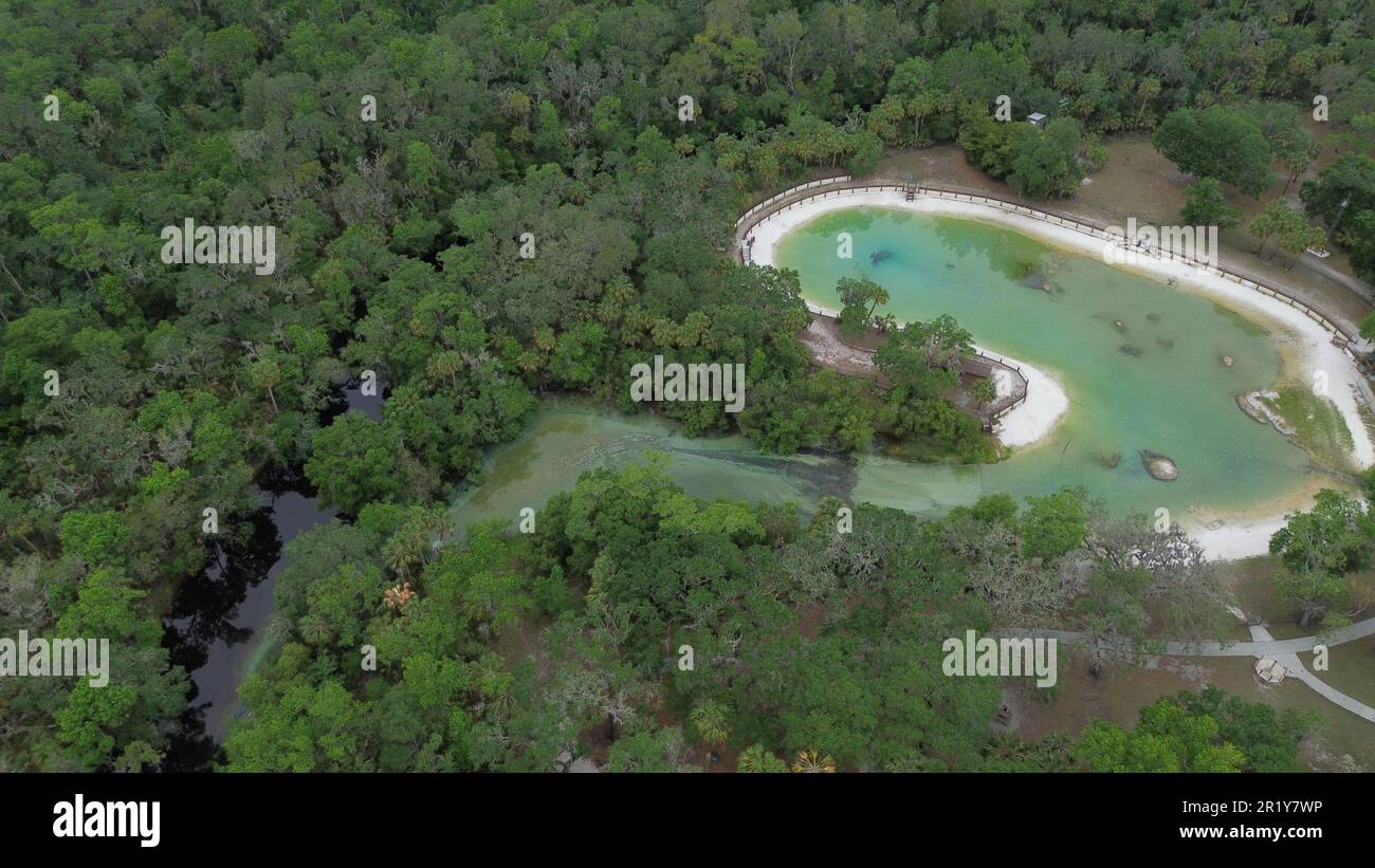 An aerial view of a scenic landscape featuring a river flowing through ...