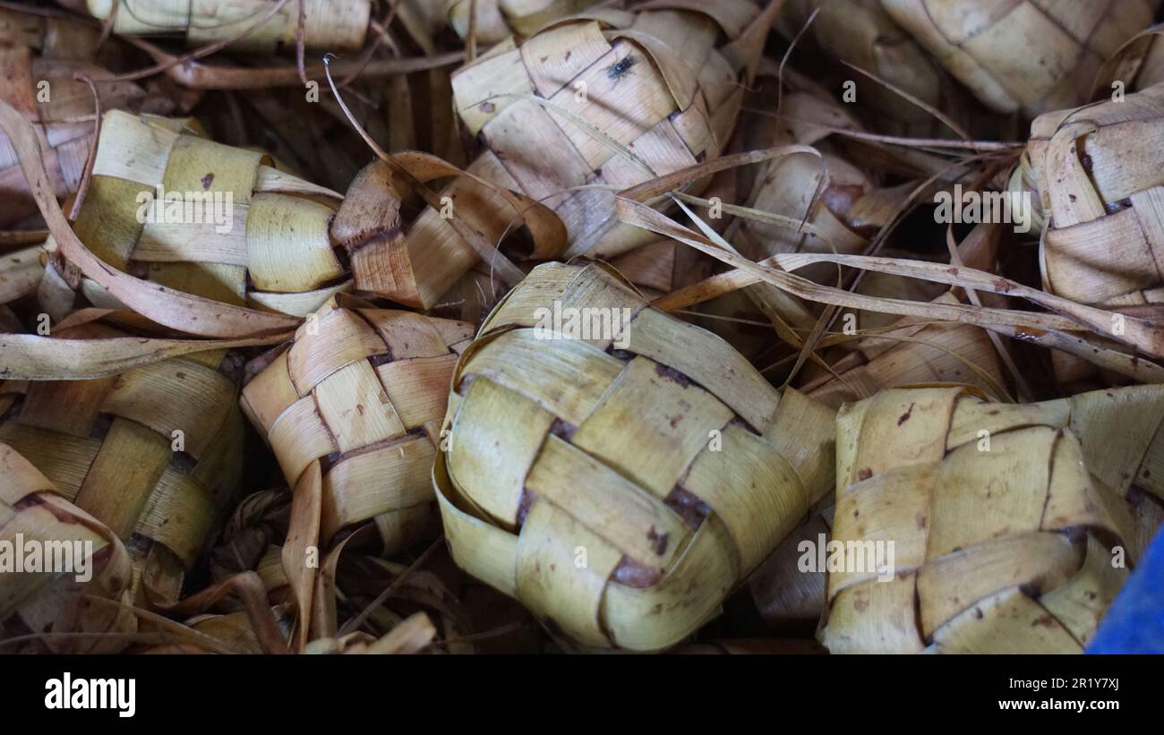 Ketupat is a typical Indonesian dish made of rice, wrapped in coconut ...