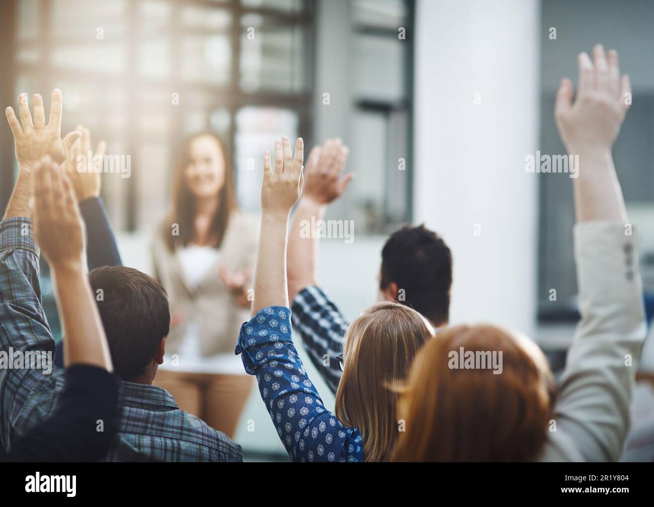 Seminar, audience from back with hands up for questions and answers at ...