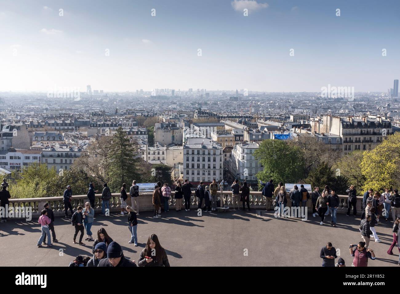 Tourists from around the world look at the view over Paris from the ...