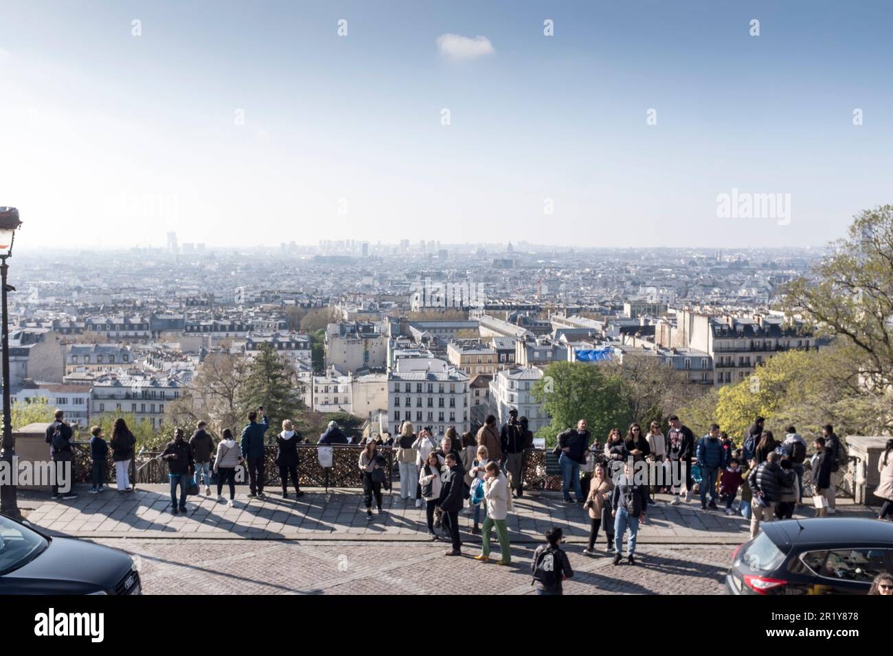 Tourists from around the world look at the view over Paris from the ...
