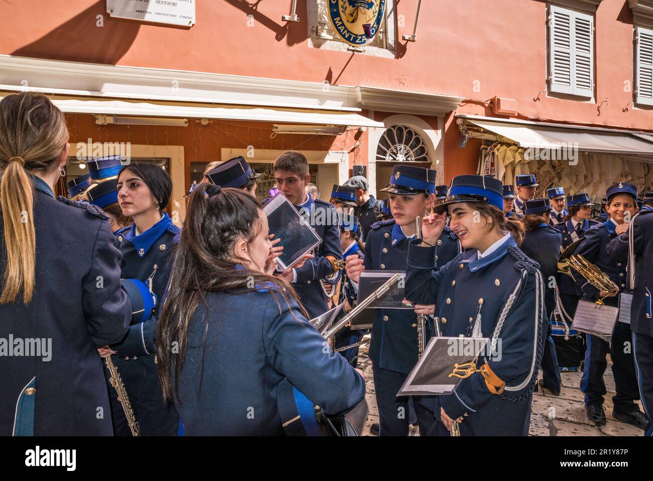Young musicians, Mantzaros marching band ready to perform, talking, in ...
