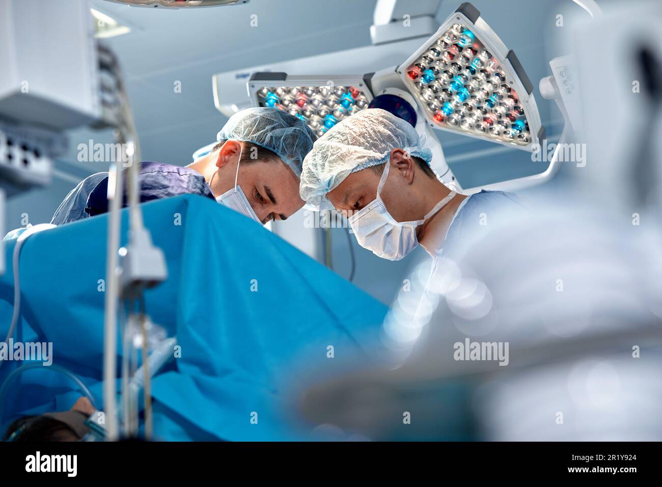 Low Angle Shot in the Operating Room. Surgeons Perform Operation ...