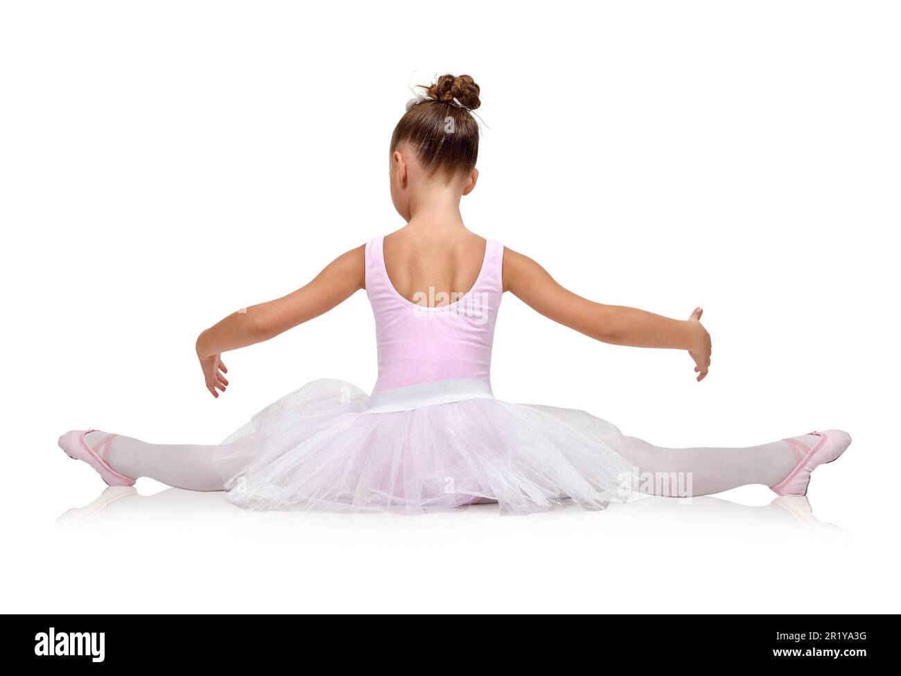little ballerina in tutu sitting on floor on white background Stock ...