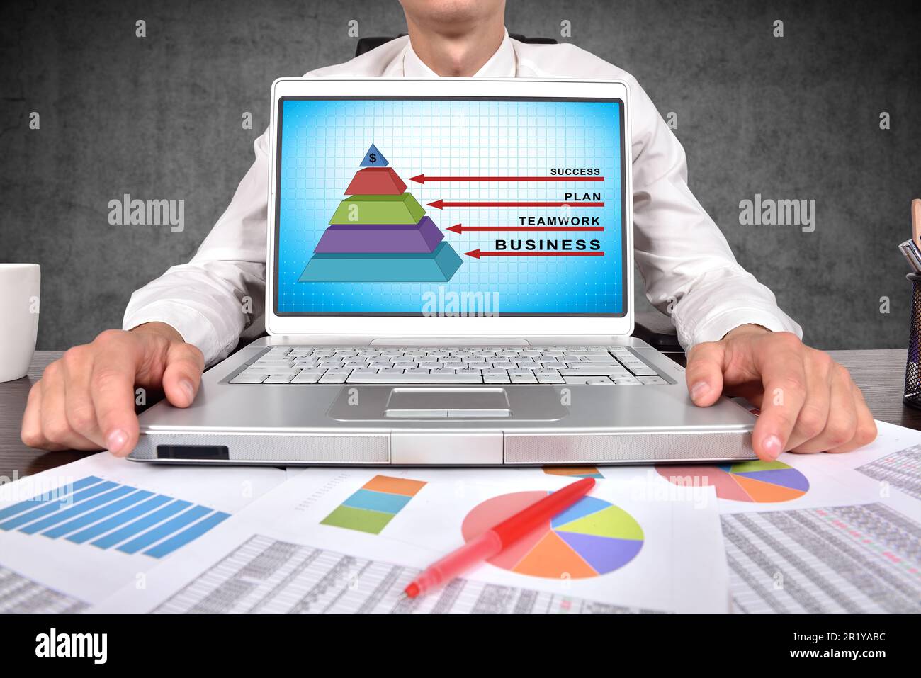 businessman sitting in office and screen laptop with business pyramid ...