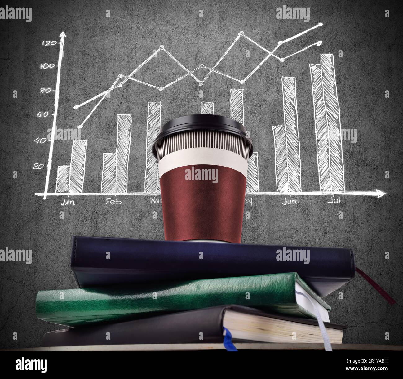 disposable coffee cup on books and drawing stock chart on wall Stock ...