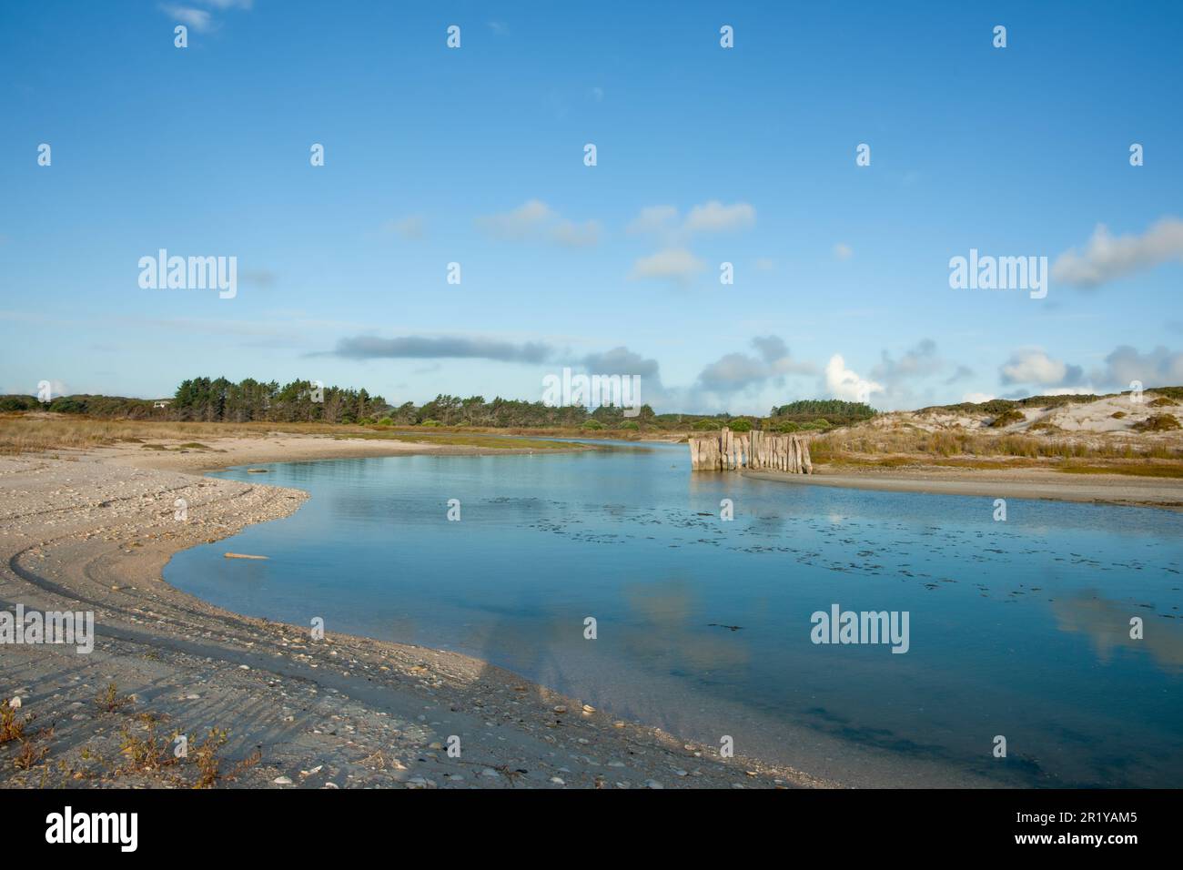 Stream running through sand dunes to beach Stock Photo - Alamy