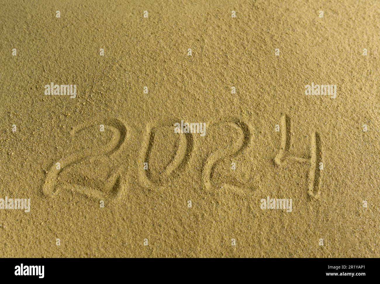 Numbers 2024 on the sea sand Stock Photo - Alamy