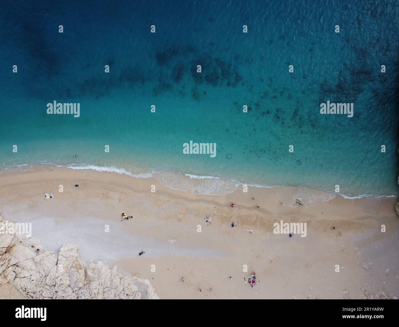 A group of people enjoying a summer day by swimming in the crystal ...