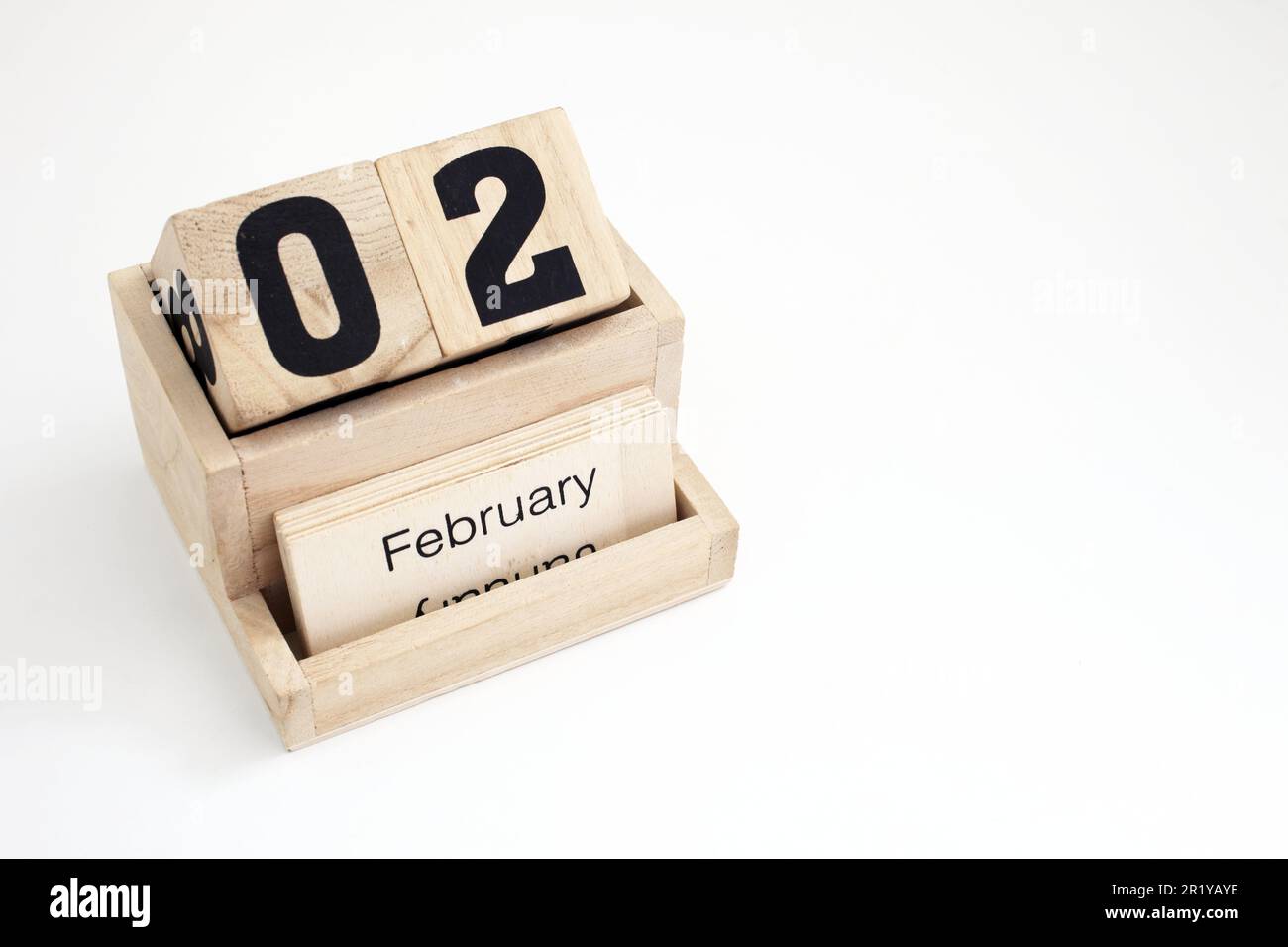 Wooden perpetual calendar showing the 2nd of February Stock Photo - Alamy