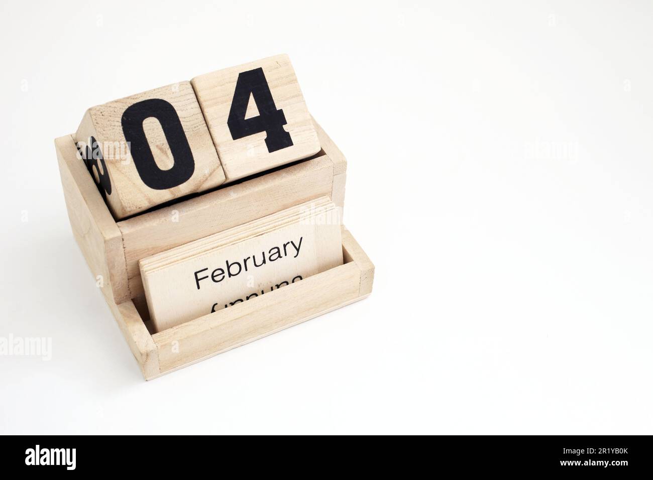 Wooden perpetual calendar showing the 4th of February Stock Photo - Alamy