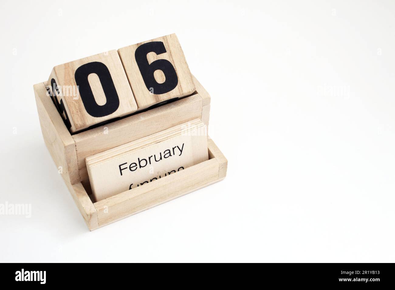 Wooden perpetual calendar showing the 6th of February Stock Photo - Alamy