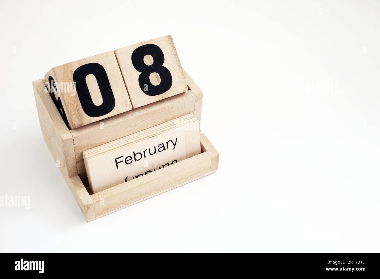 Wooden perpetual calendar showing the 8th of February Stock Photo - Alamy