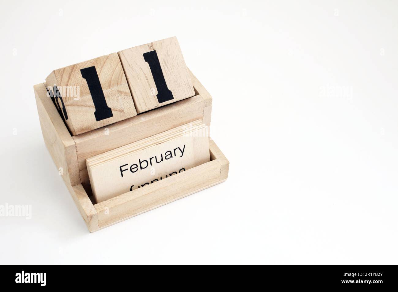 Wooden perpetual calendar showing the 11th of February Stock Photo - Alamy