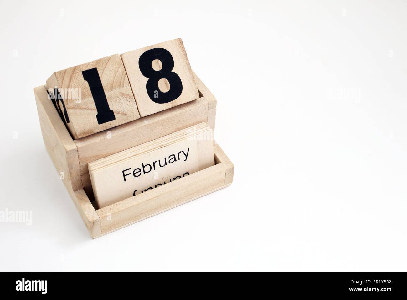 Wooden perpetual calendar showing the 18th of February Stock Photo - Alamy
