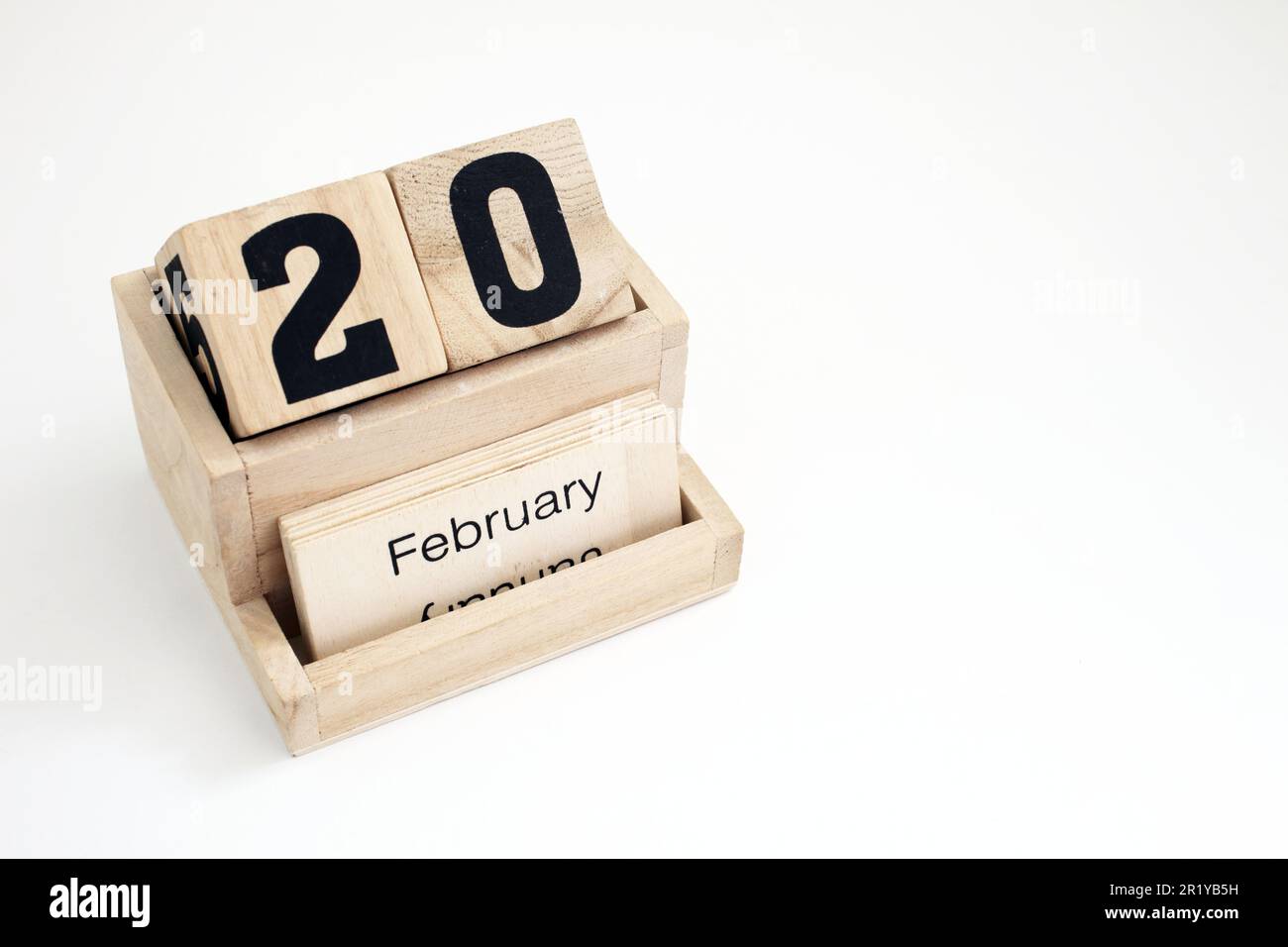 Wooden perpetual calendar showing the 20th of February Stock Photo - Alamy