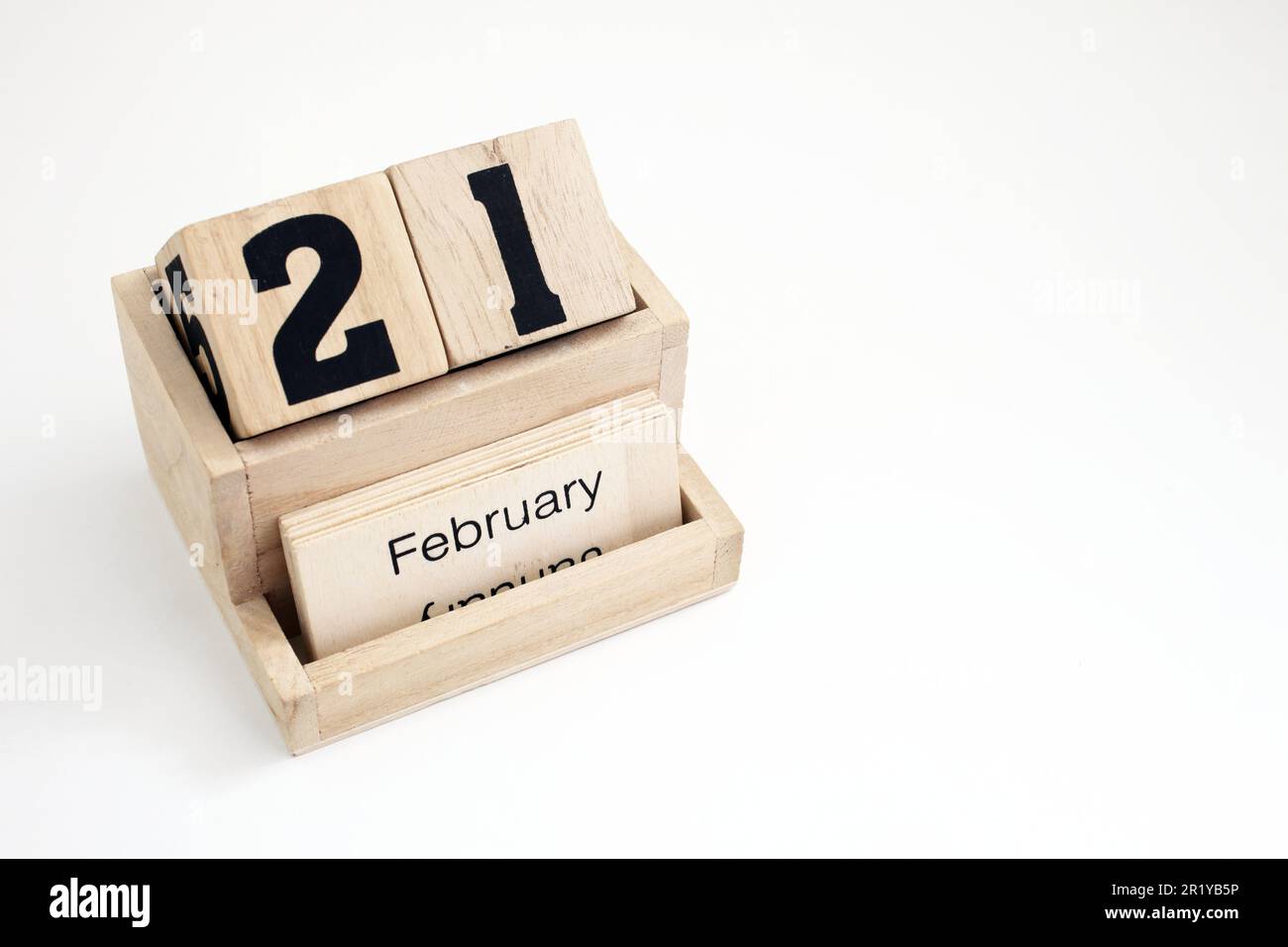 Wooden perpetual calendar showing the 21st of February Stock Photo - Alamy