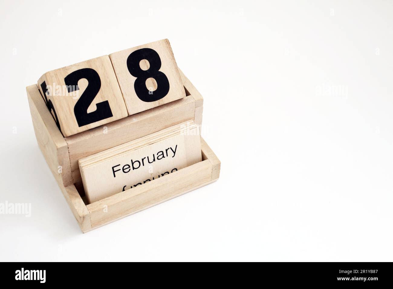 Wooden perpetual calendar showing the 28th of February Stock Photo - Alamy