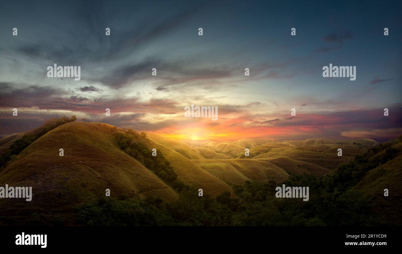 Green hills with landscape view with a sunset sky background. Nature ...