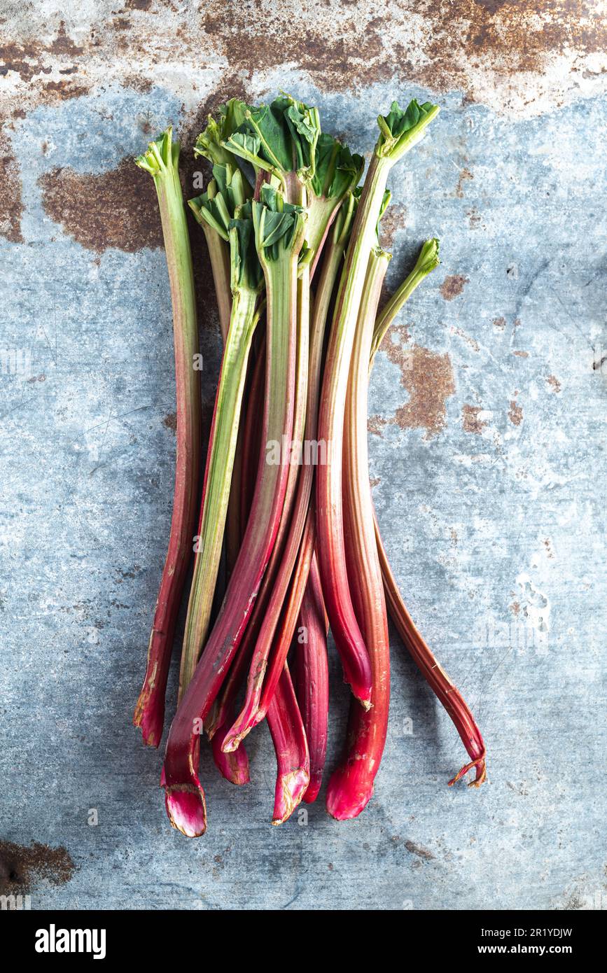 A top view of a bundle of rhubarb on rustic metal background Stock ...