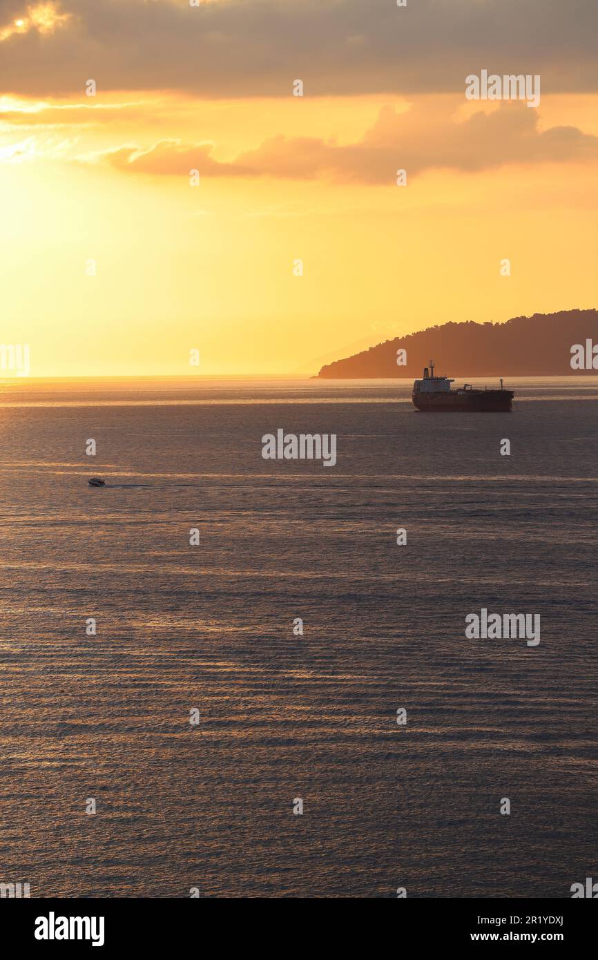 A majestic sailing boat with a white hull gliding through a serene ...