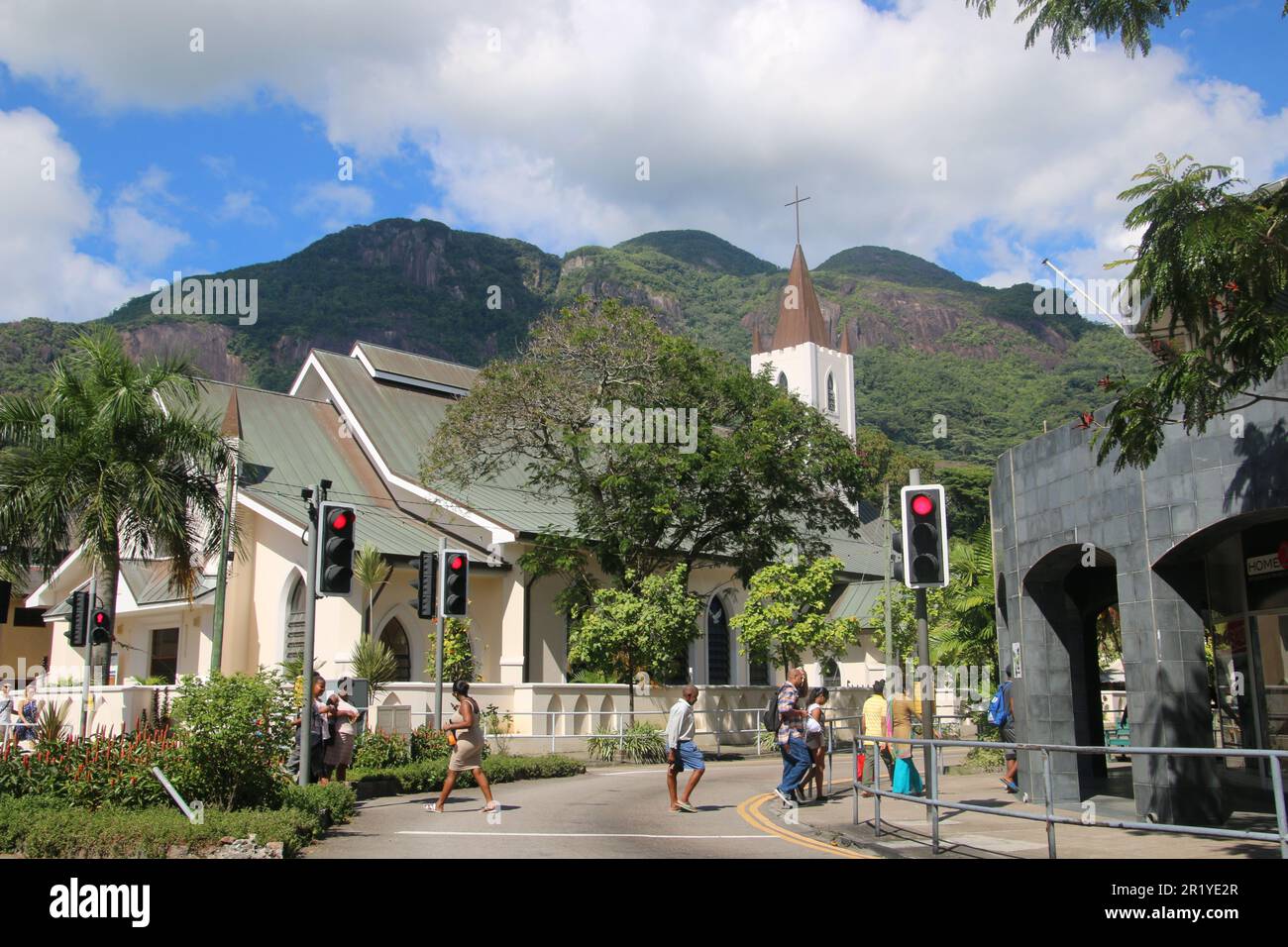 Busy scene on the street in the front of a small shop in town center ...