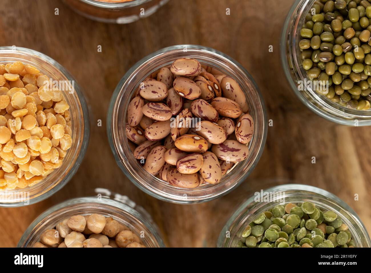 Legumes in glass jars top view. Vegetable protein, vegetarianism ...