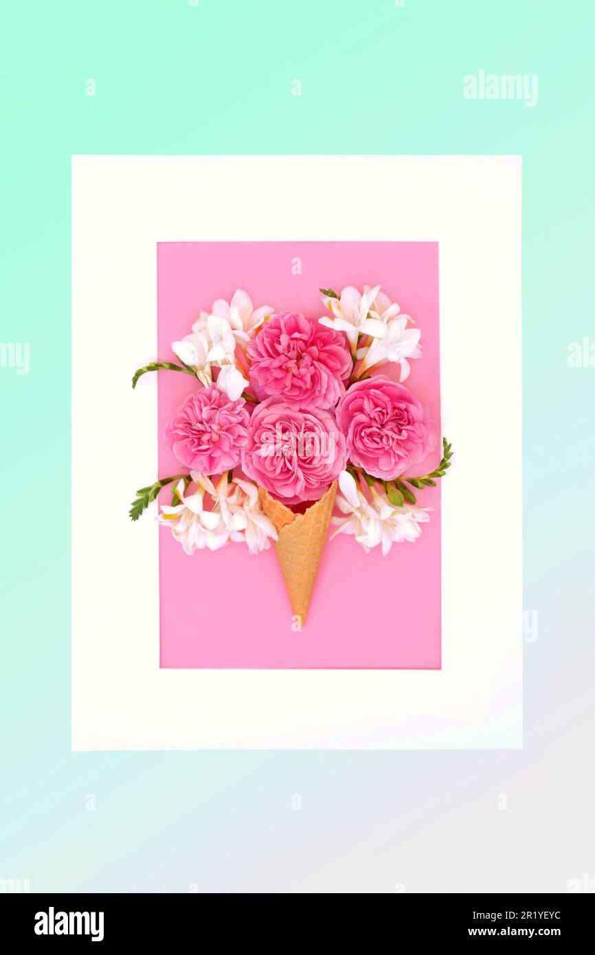 Summer fun ice cream cone with rose and freesia flowers, white frame on ...