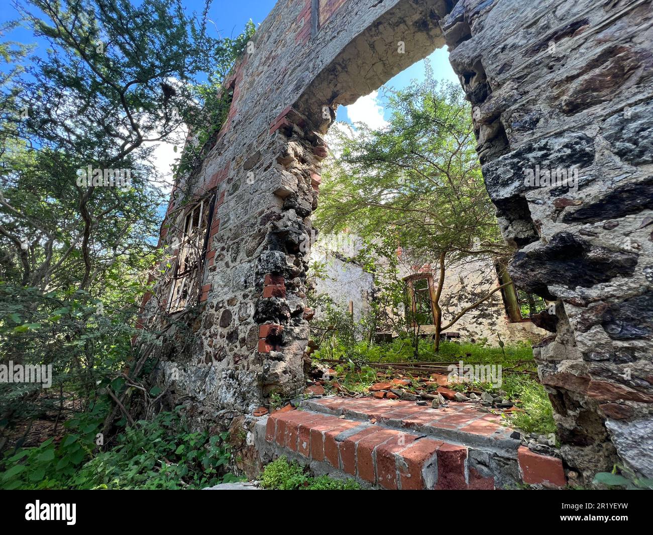 A picturesque landscape of a historical building in ruins, nestled ...