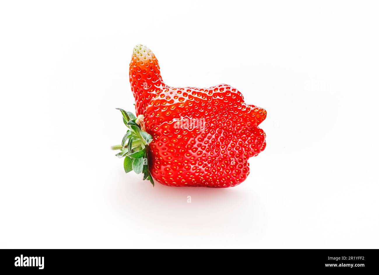 Unusual strawberry in the shape of hand with thumb up similar the like ...
