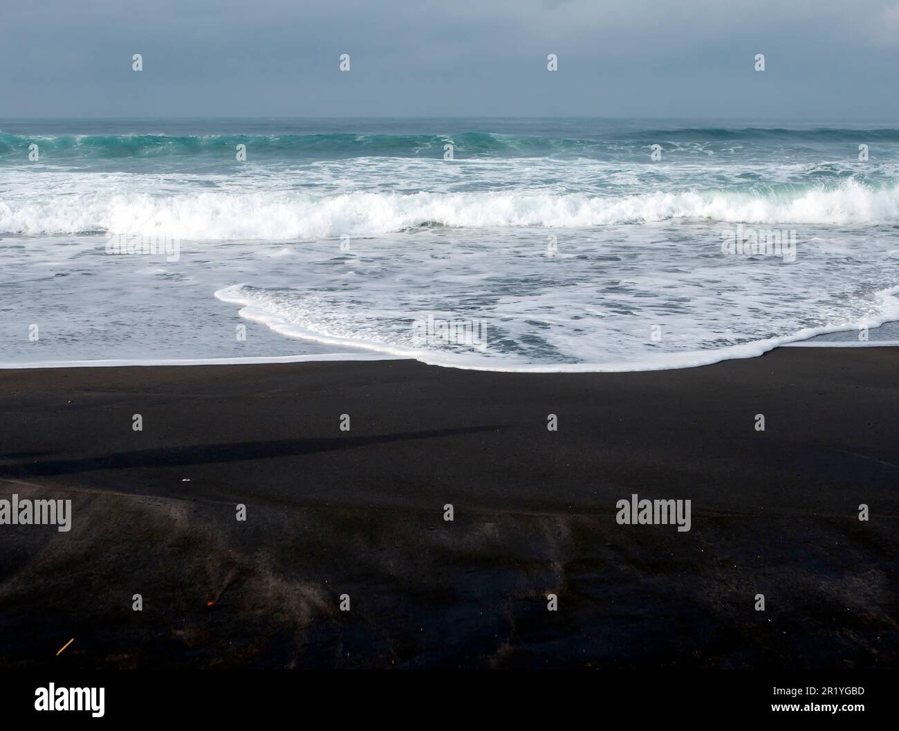 Dark sandy seashore on Parangtritis Beach, in Yogyakarta, Indonesia ...