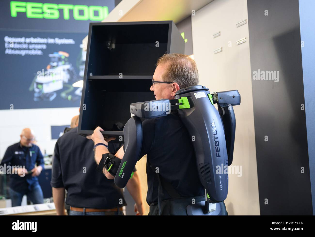 Hanover, Germany. 16th May, 2023. An employee holds a cabinet with the ...