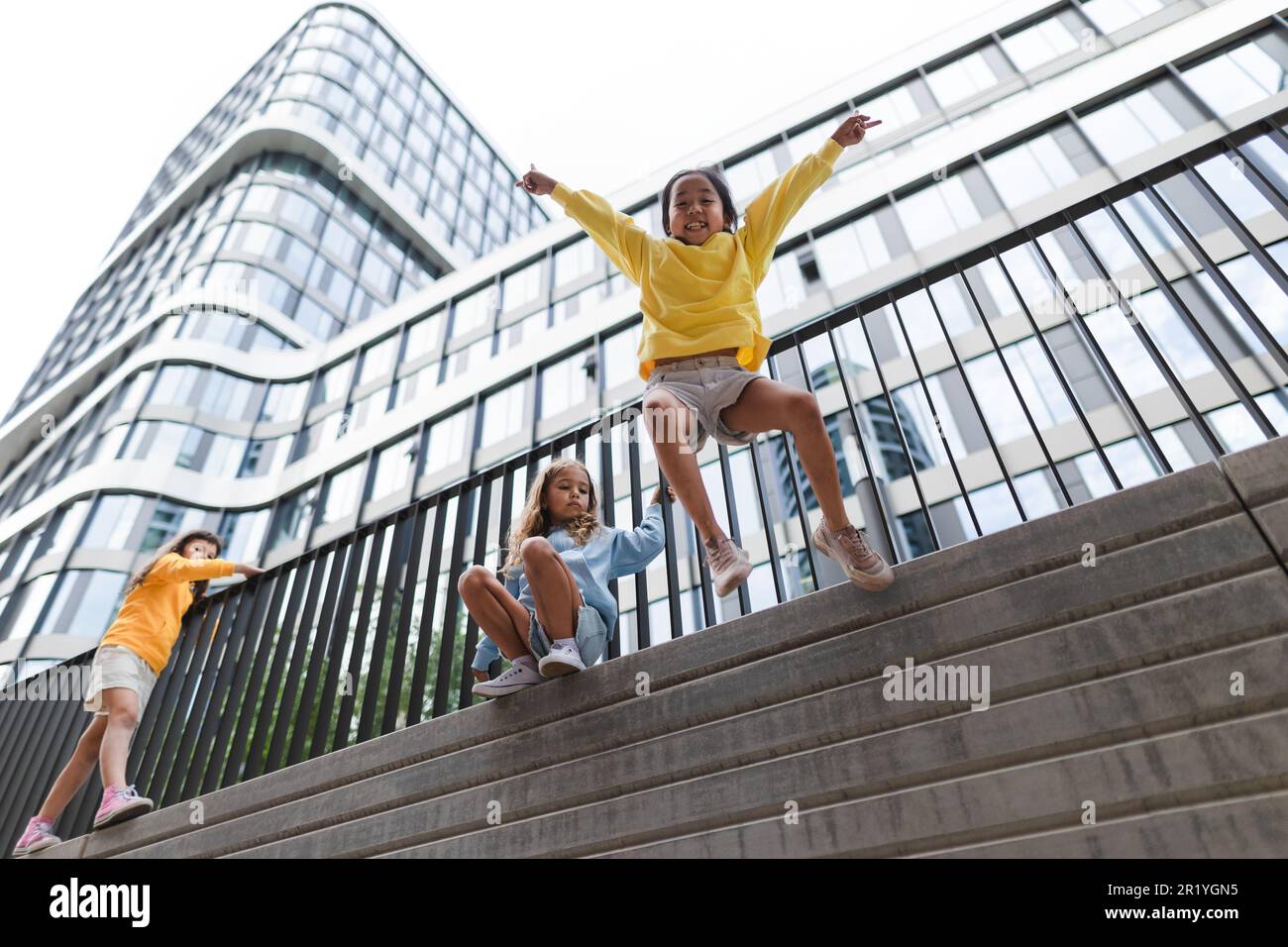 Two children jumping from hi-res stock photography and images - Alamy